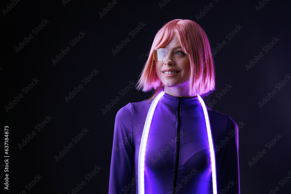 Beautiful woman in futuristic costume with flowing hair while touching ...