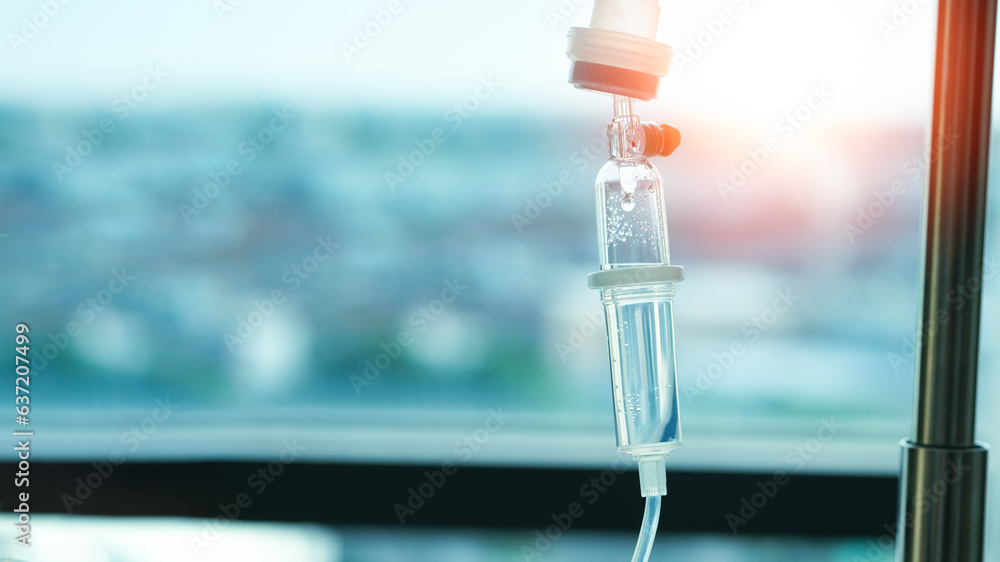 Close up saline solution drip for patient and infusion pump in hospital ...