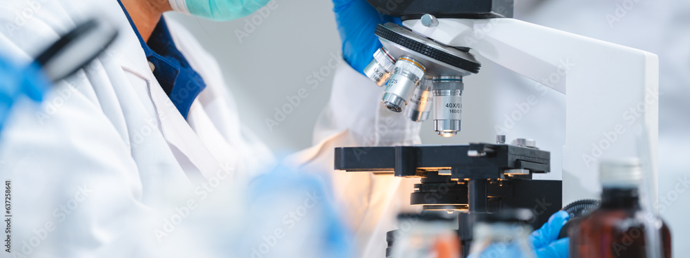 professional chemist woman laboratory using scientific microscope for ...