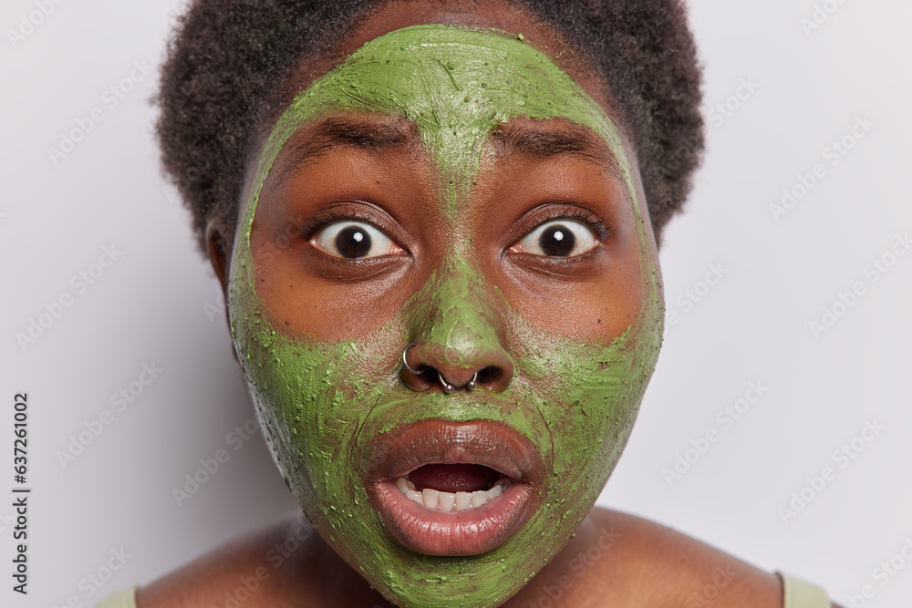 Beauty and cosmetology concept. Studio photo of young scared African ...