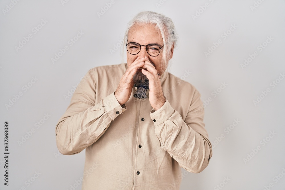 Middle age man with grey hair standing over isolated background ...