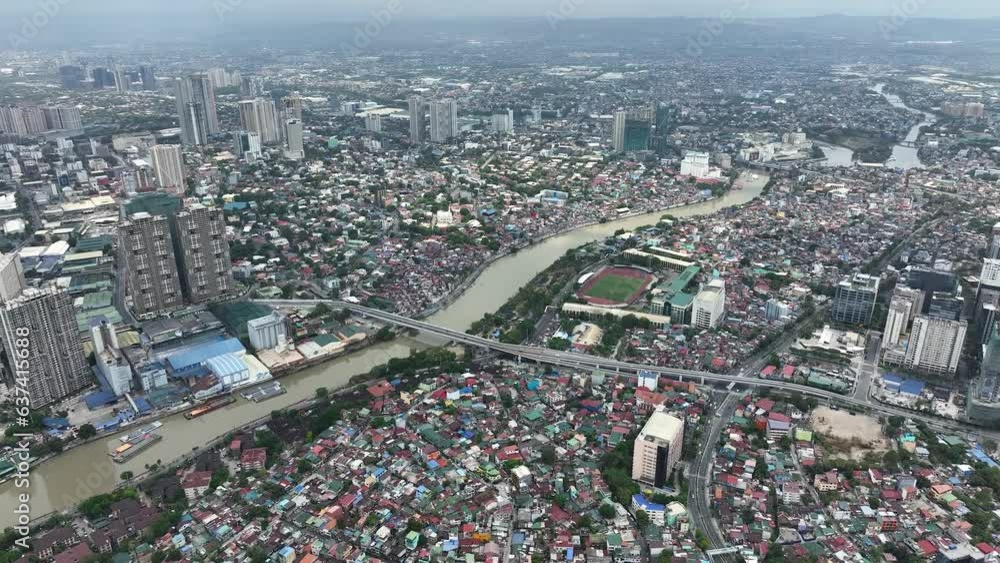 Manila cityscape at river banks aerial. Downtown area with cottages ...