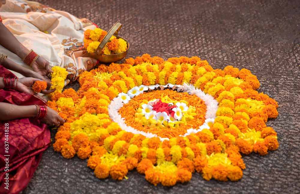 Kerala girls celebrating Onam festival and making Onam pookalam with ...