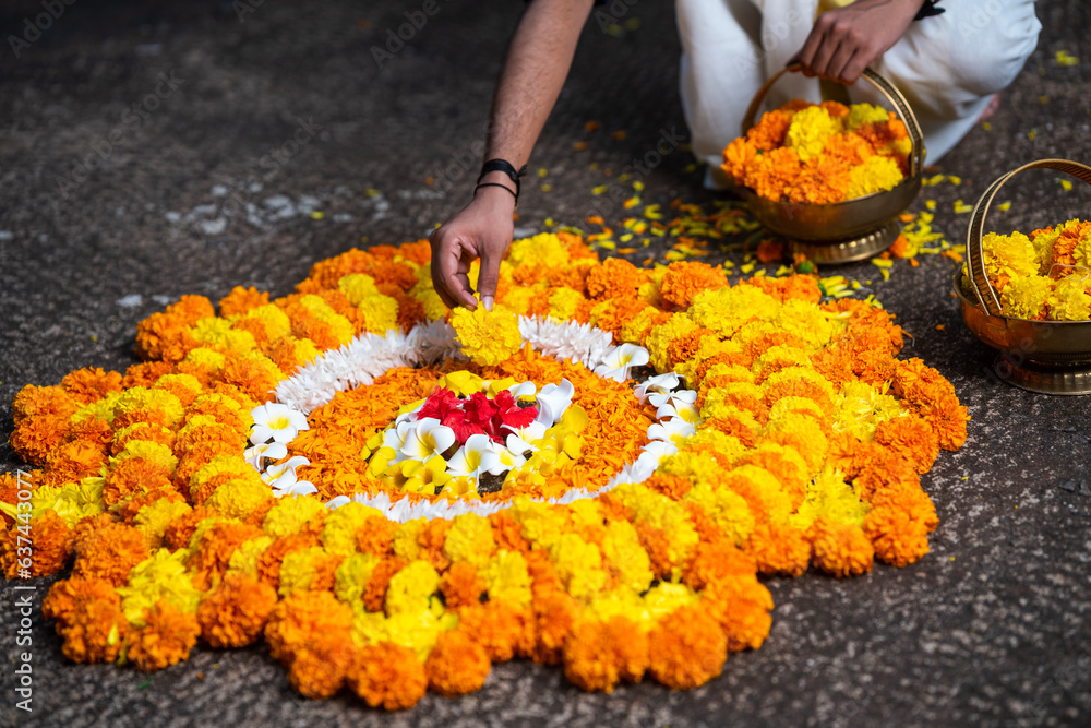 Person making Onam flower decoration, Kerala traditional festival Onam ...