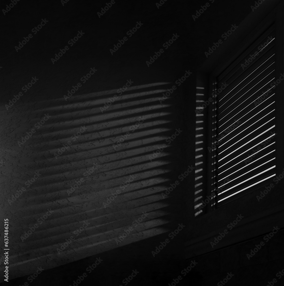 interior of red dark room. shadow of the rays falling on the wall ...