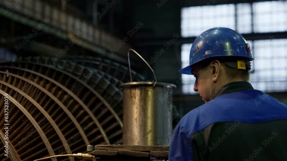 Industrial Worker Inspection Of Turbine Working on testing stand at ...