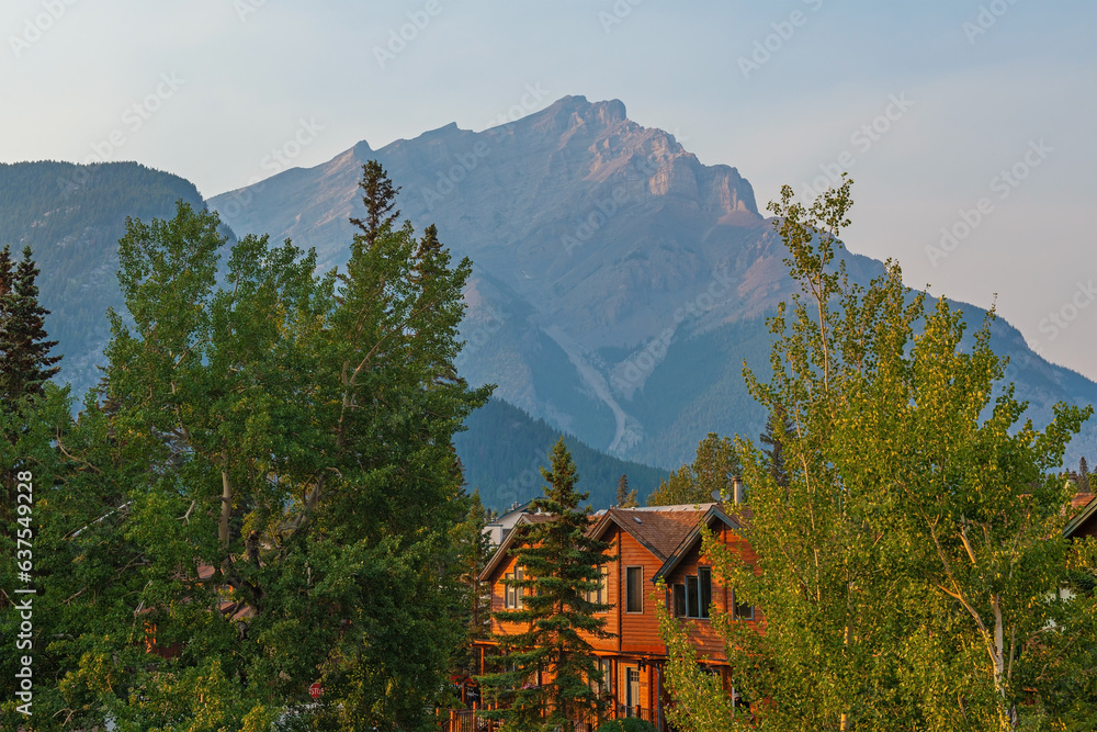 Sunrise in Banff with traditional wooden alpine architecture, Banff ...