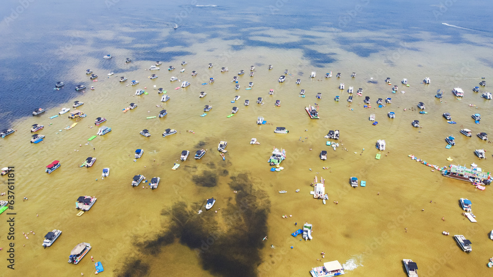Crowd of people at Crab Island in Destin, Florida during low tide with ...