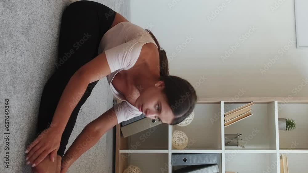 Vertical video. Forward bend. Paschimottanasana exercise. Home yoga ...