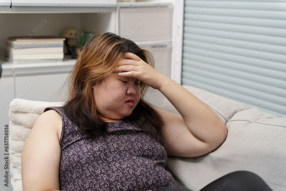Sad Overweight plus size woman thinking about problems on sofa upset ...