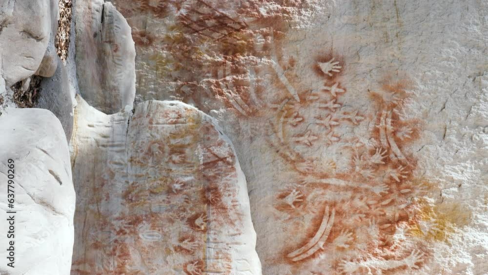 Ochre stencils and free-hand cave paintings created by the first ...