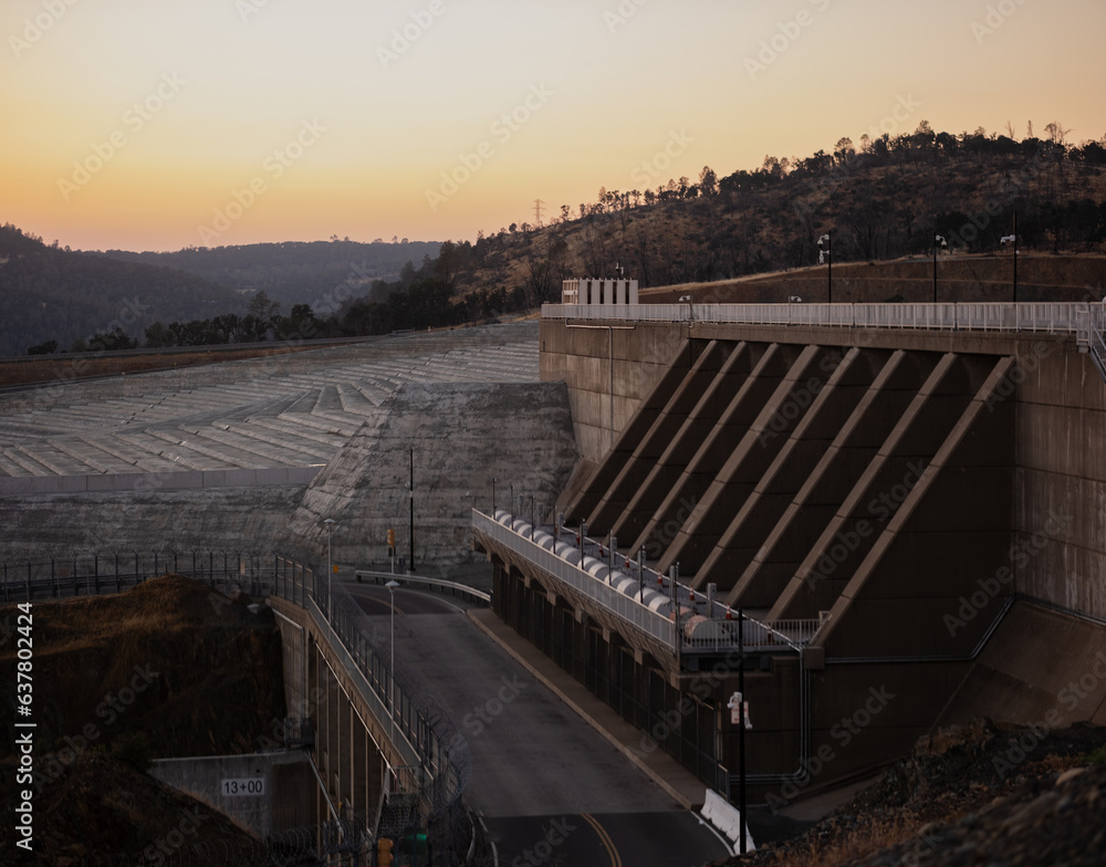 Oroville Dam at sunset, showing the massive outflow mechanism, and a ...