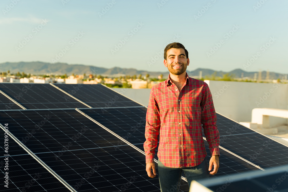 Attractive man happy using clean energy with solar panels Stock Photo ...