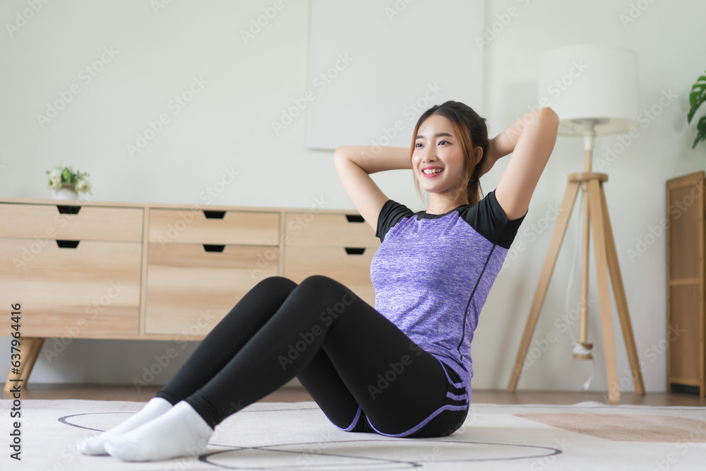 Young asian woman put hands behind head to doing exercise and workout ...