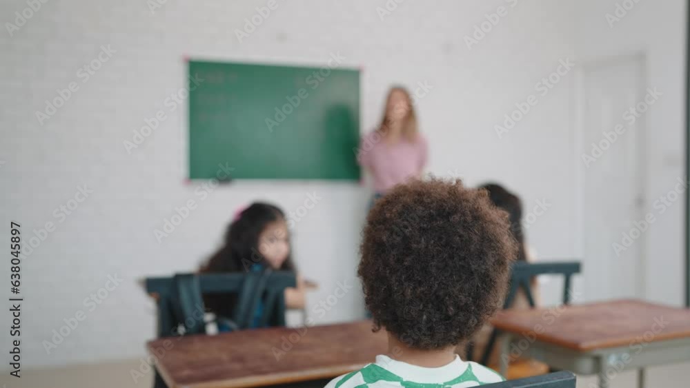 African American boy student raising hand to ask a question during ...