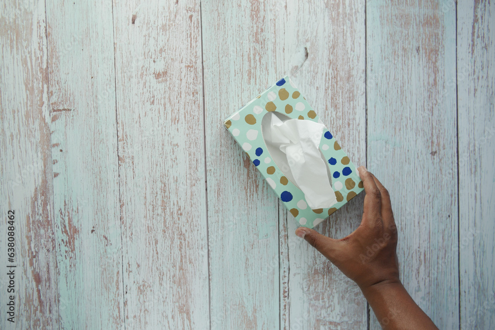 hand pull out a piece of tissue from tissue paper box Stock Photo ...