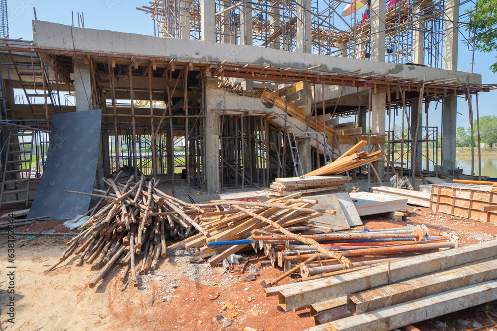 Busy industrial under construction site workers working with cranes and ...
