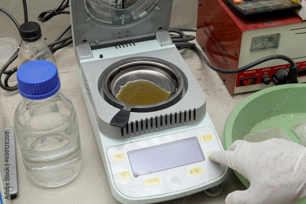 The analyzer is analyzing the water content of oil using a water ...