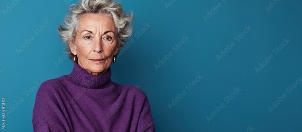 70 years old model posing for the colors of life. Aging woman standing ...