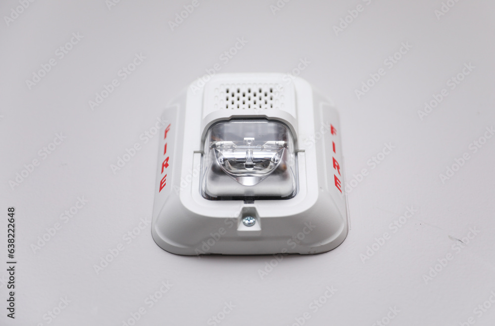Vivid fire alarm, a symbol of urgency and safety, warns of danger ...