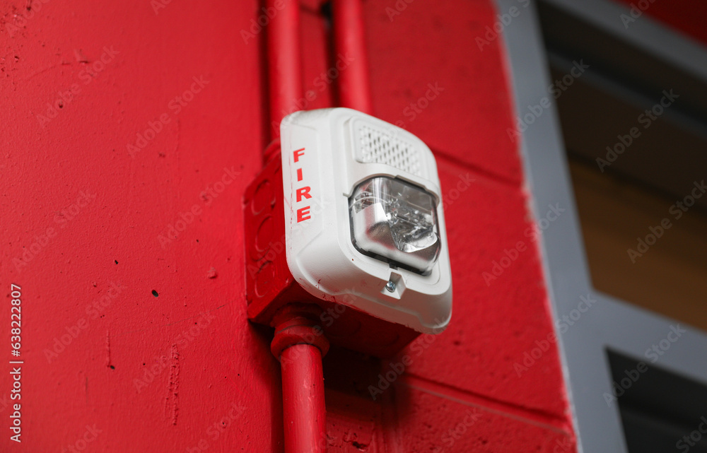 Vivid fire alarm, a symbol of urgency and safety, warns of danger ...