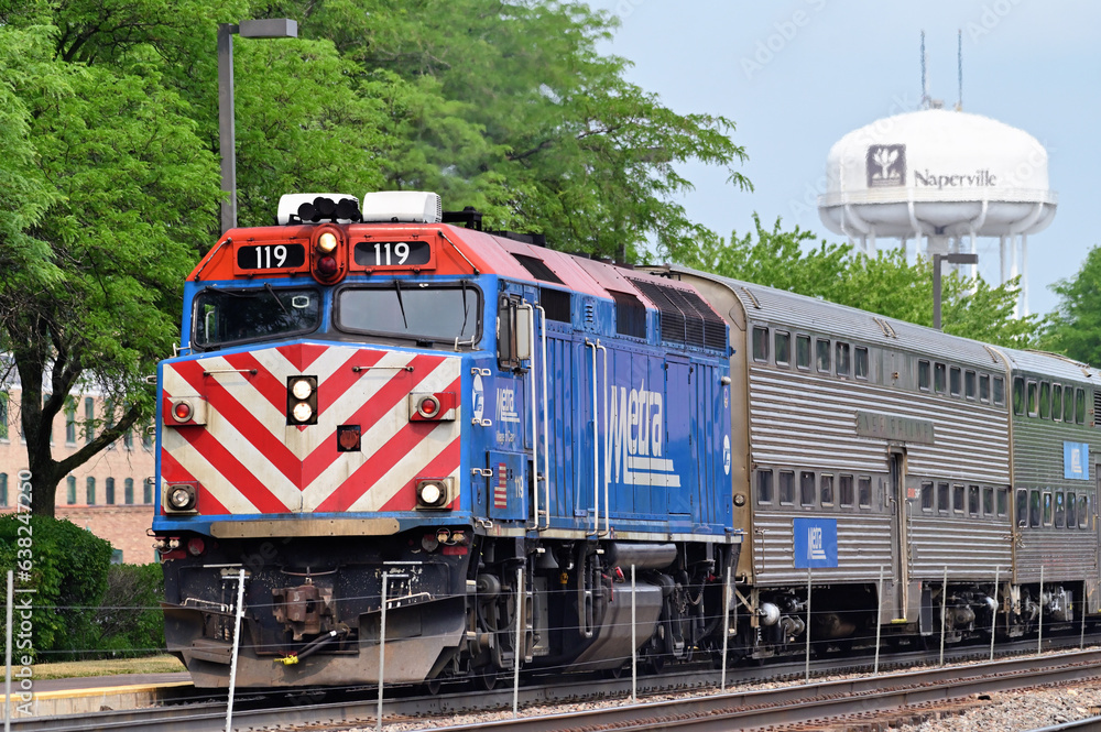 A Metra commuter train arriving at a local commuter train station on ...
