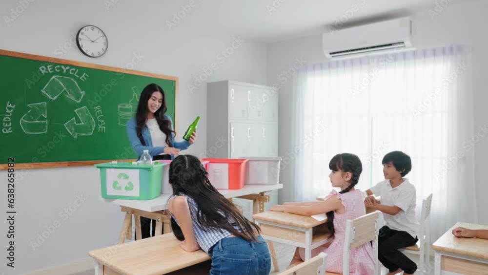 Attractive female teacher teach selecting and separating waste for ...