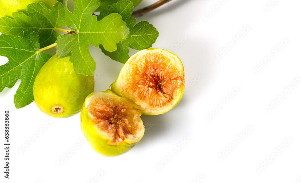 Fig fruits. Ripe sweet yellow, green figs fruit with leaves close up ...