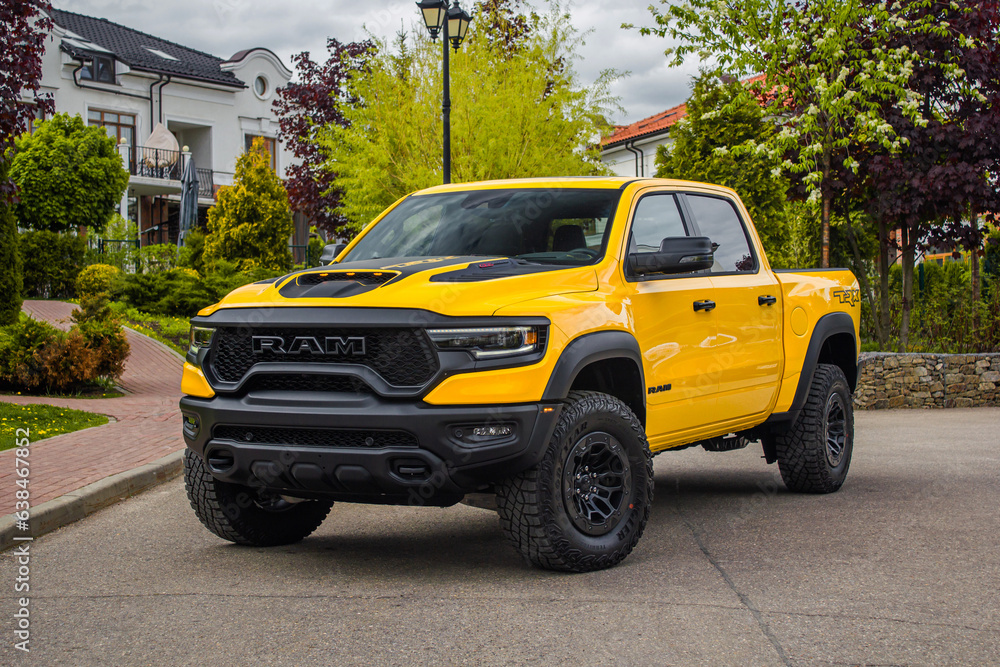 car on the road yellow 2023 Ram 1500 TRX Off-Road Performance Truck ...