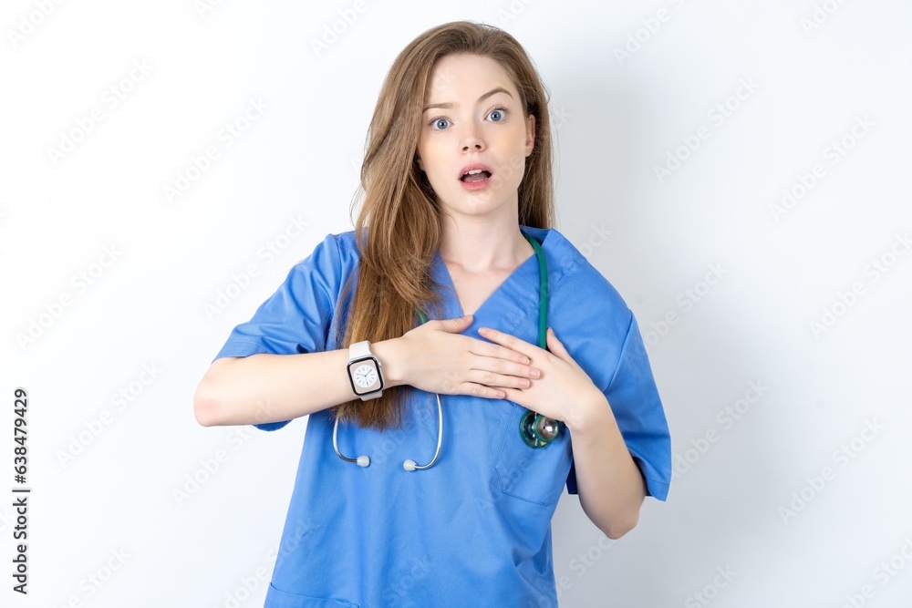 Scared young beautiful doctor woman looks with frightened expression ...