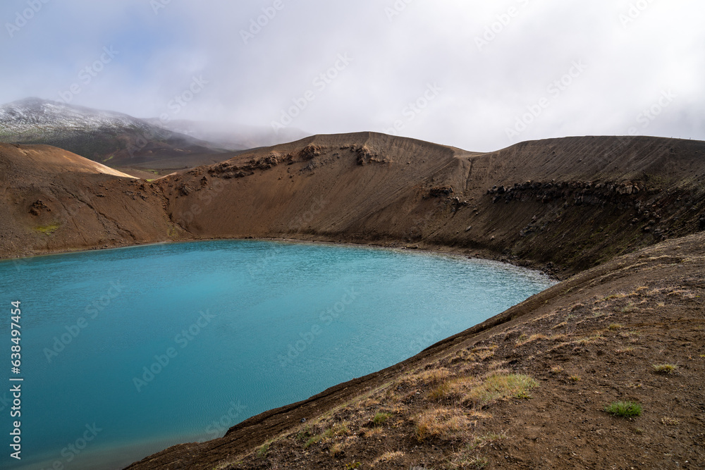 Viti Crater, a volcanic crater filled with teal water, near Krafla and ...