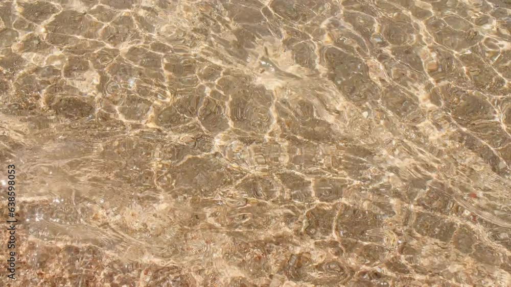 Water splash. Sand, corals. Pure water with reflections sunlight and ...