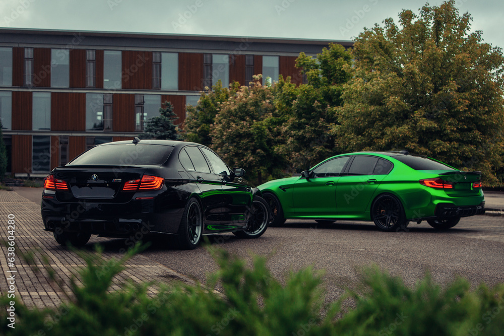 BMW M5 F90 and BMW F10 M5 Competition at the parking of business center ...