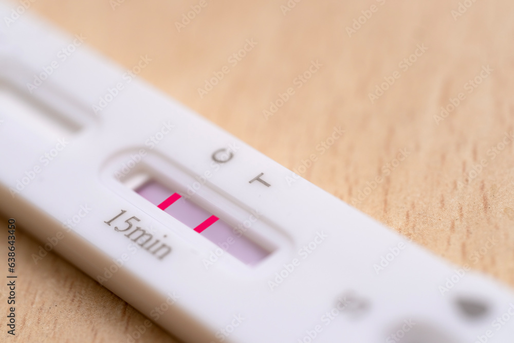 positive test for covid, antigenic test cassette, conducting rapid test ...