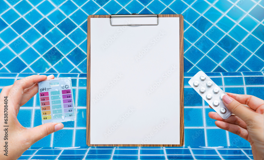 Pool tester test kit and reagent tablets in girl hand with wooden ...