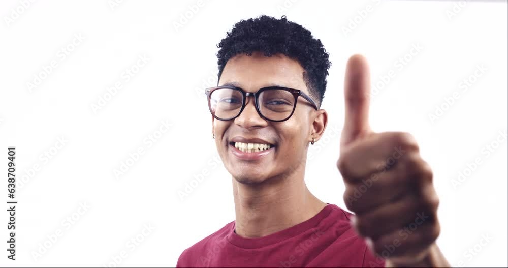 Thumbs up, face of man and happy in studio for winning, agreement and ...