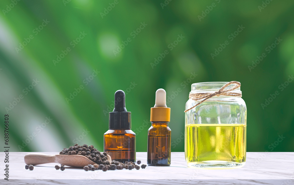 Two dropper bottles with herbal essential oil from black pepper in ...