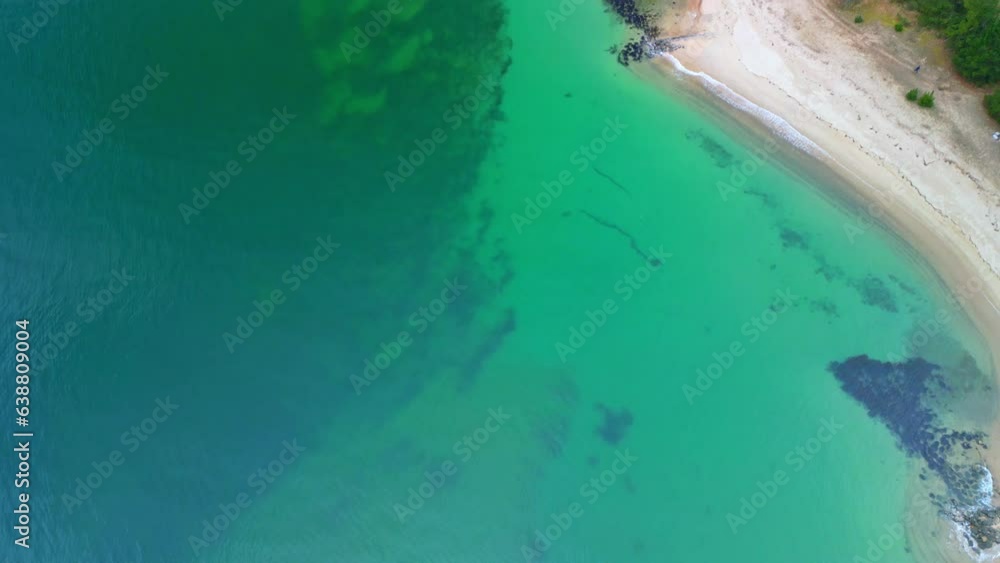 Aerial Tilt up drone shot of Amanohashidate pine-covered sandbar one of ...