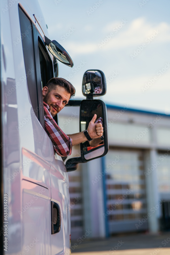 Truck driver sitting in his truck showing thumbs up. Trucker occupation ...