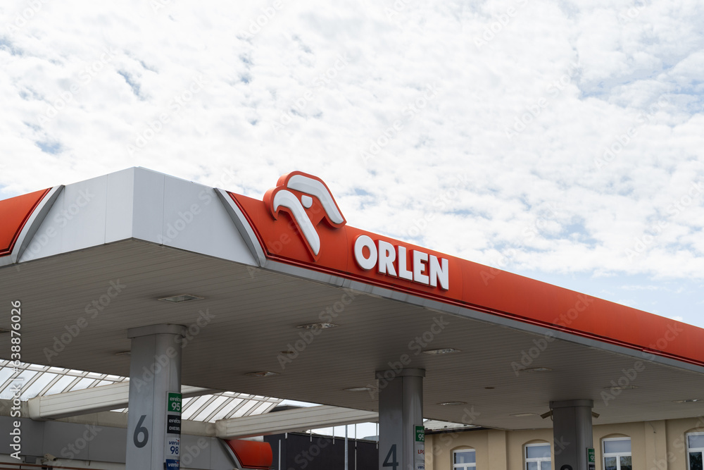 Orlen gas station with logo sign. Polish oil company filling petrol station, with gasoline pump ...
