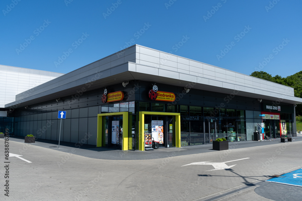 Biedronka supermarket shop with brand logo sign. Discount retail chain ...