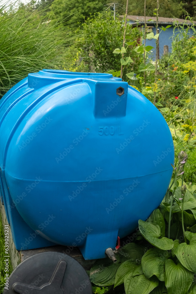 water collection tank under a roof with a drain. Rain water harvesting ...