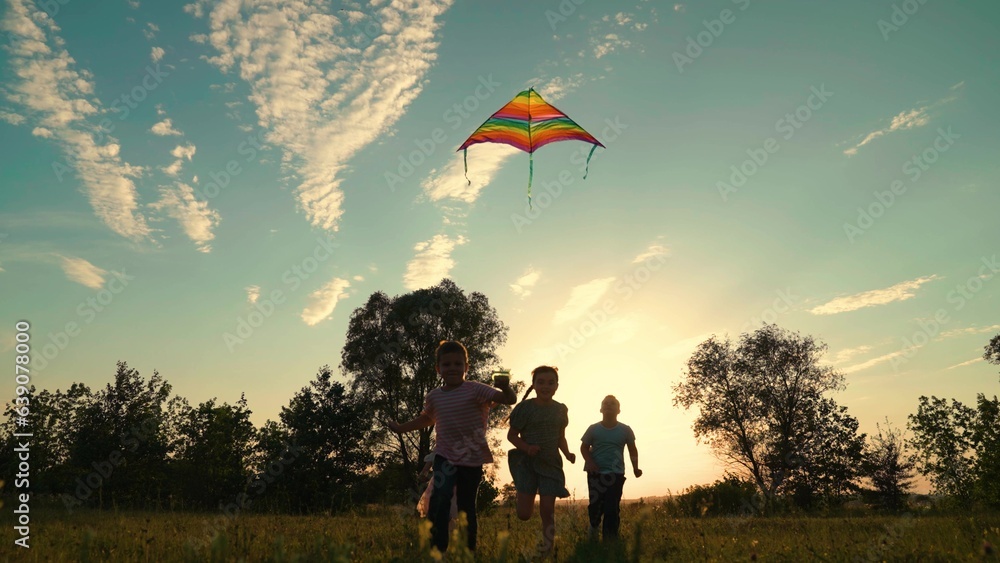 Boy girl, flying toy kite high in sky, childish emotions. Concept of ...