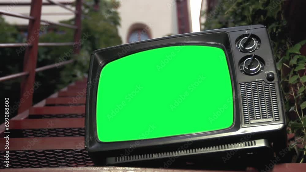 Old Television Green Screen on Outdoor Staircase. Close Up. You can ... Old Television Green Screen on Outdoor Staircase. Close Up. You can ...