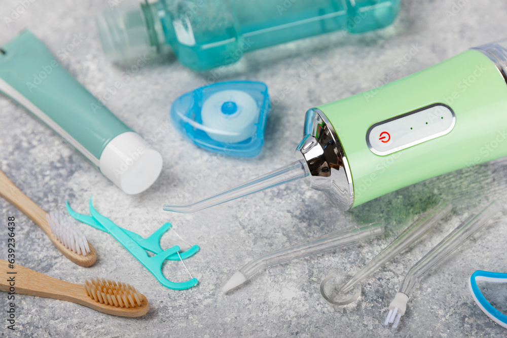 Electronic oral irrigator, toothbrush, paste, dental floss and ...