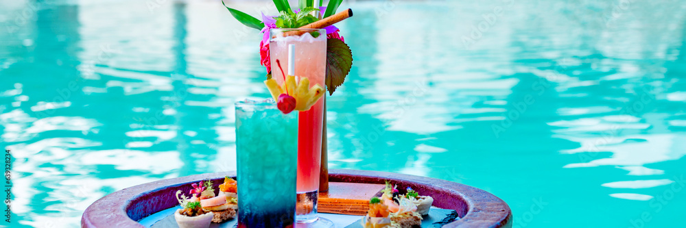 served floating tray in swimming pool with drinks and snacks on ...