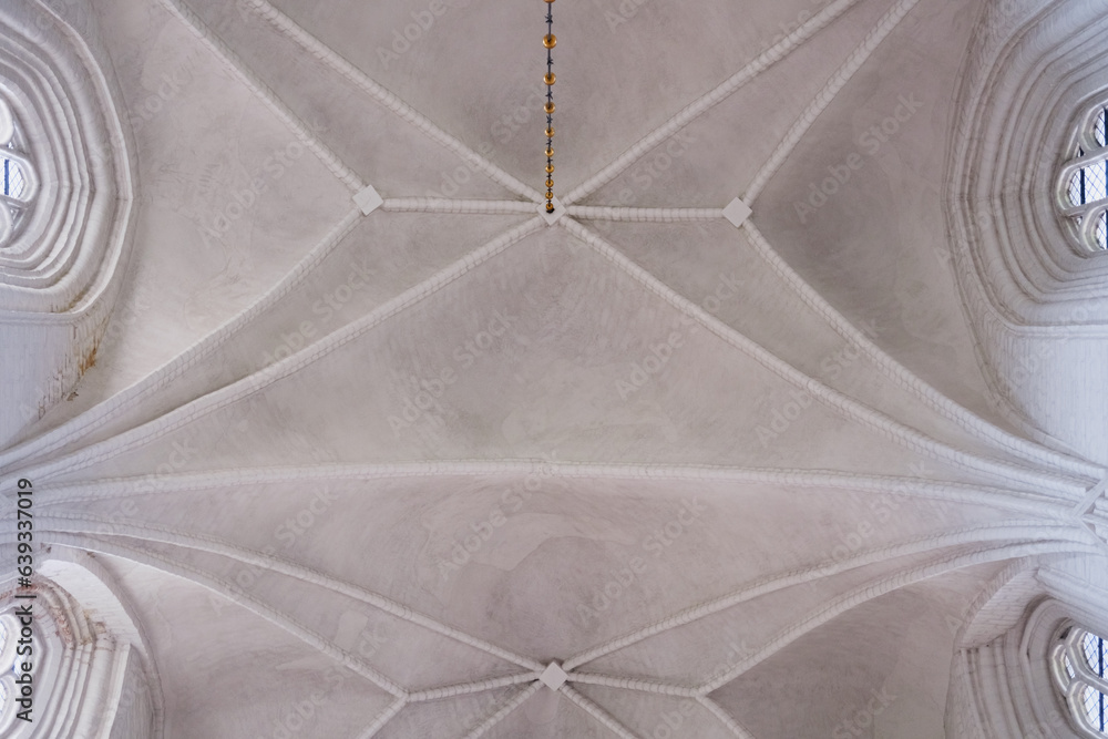 Interior ceiling of a church, simple in white, the ribs for unloading ...