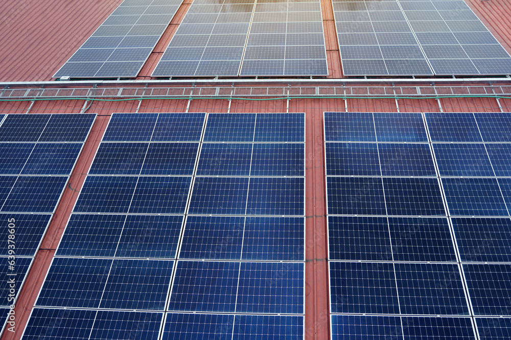 A solar roof system in a building that installs solar panels on the ...