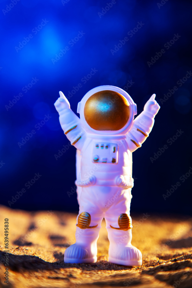 Astronaut in a space suit raised his hands in a sign of welcome on ...