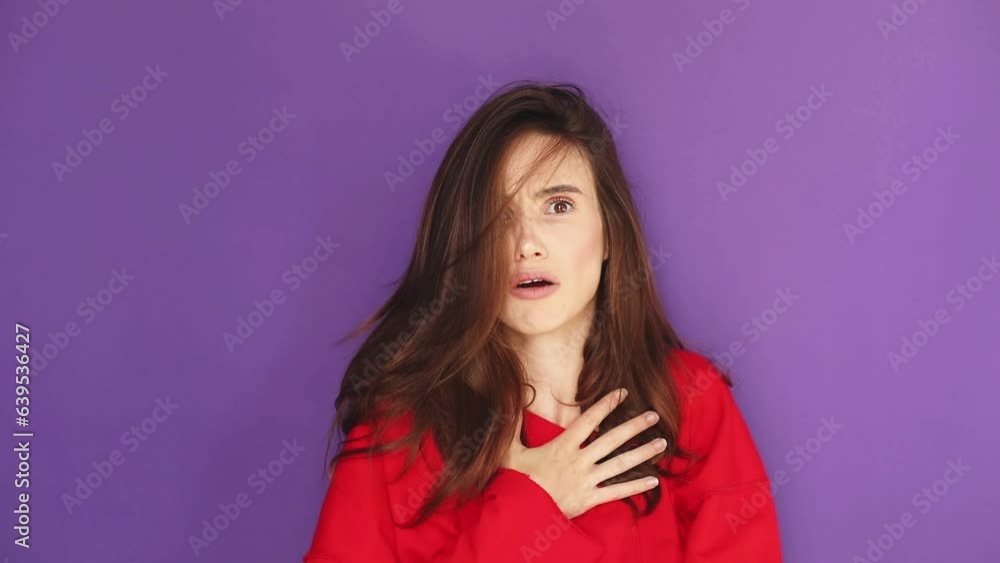 Worried brunette woman watching scary horror movie shock surprise ...